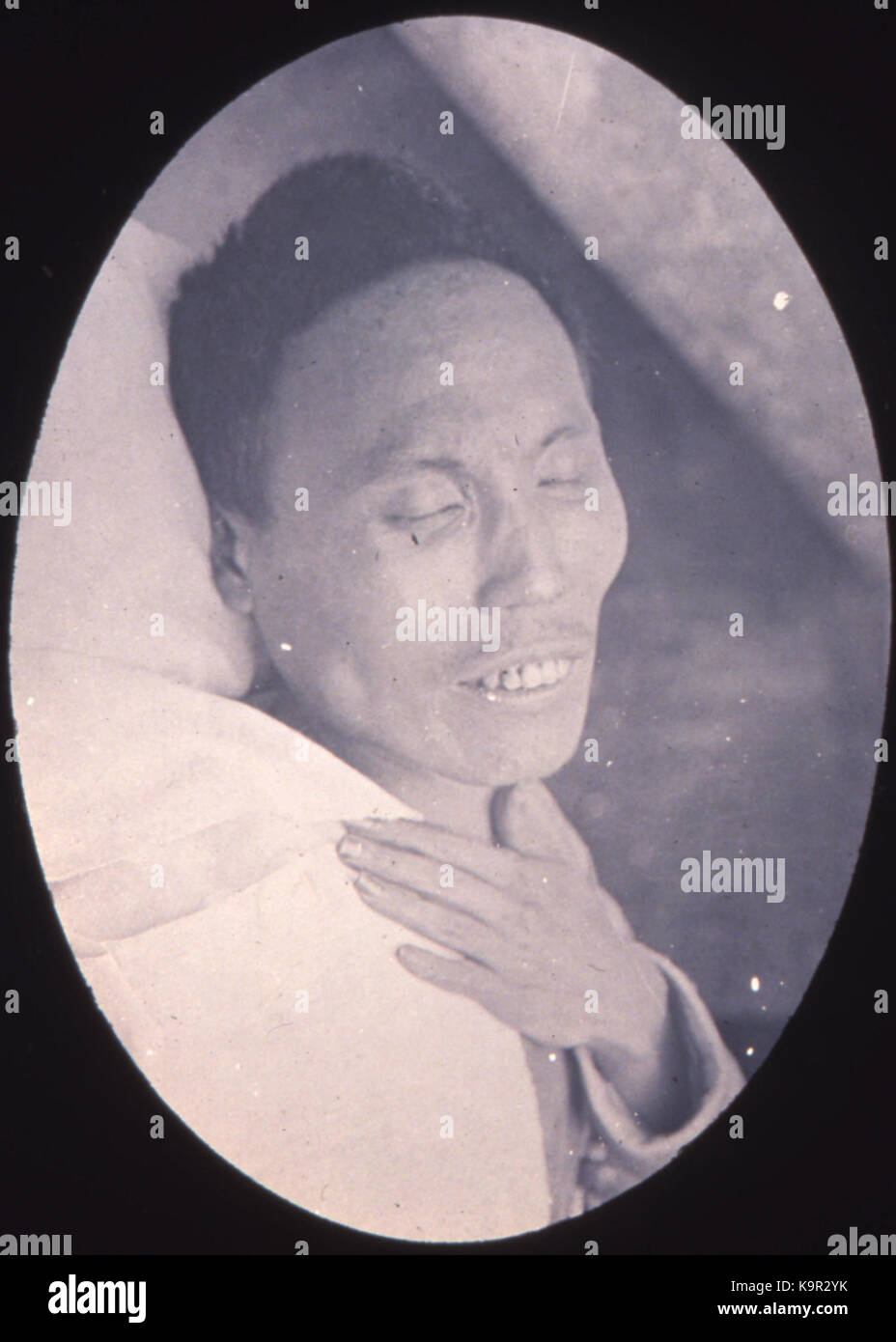 Portrait of Chinese man with eyes closed, Changde, Hunan, China, ca ...