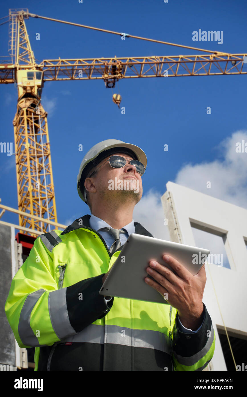 Construction engineer wearing safety vest Stock Photo - Alamy