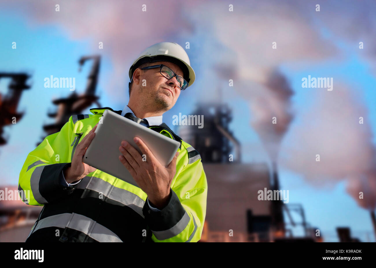 Construction engineer against blue sky Stock Photo - Alamy