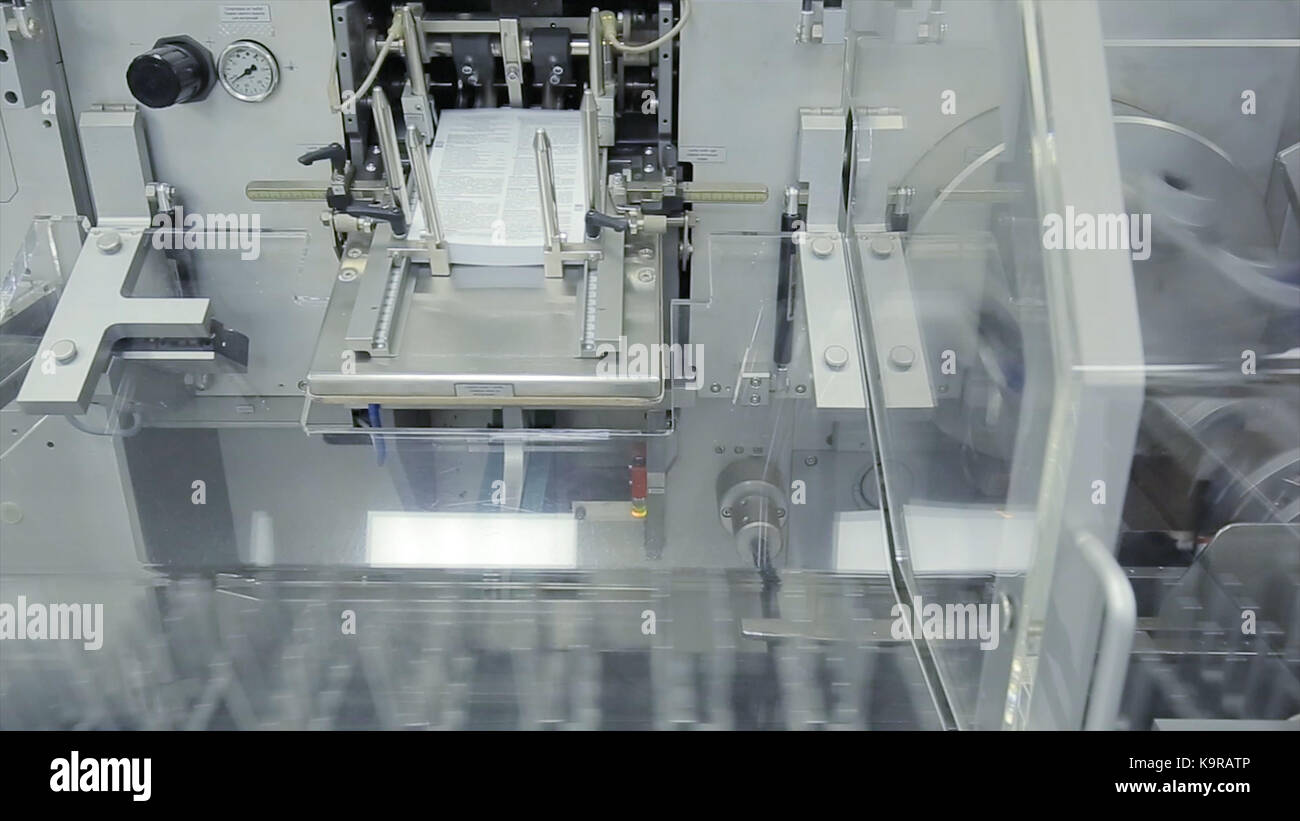 Interior of a pharmaceutical industry equipment for packing pills boxes ...