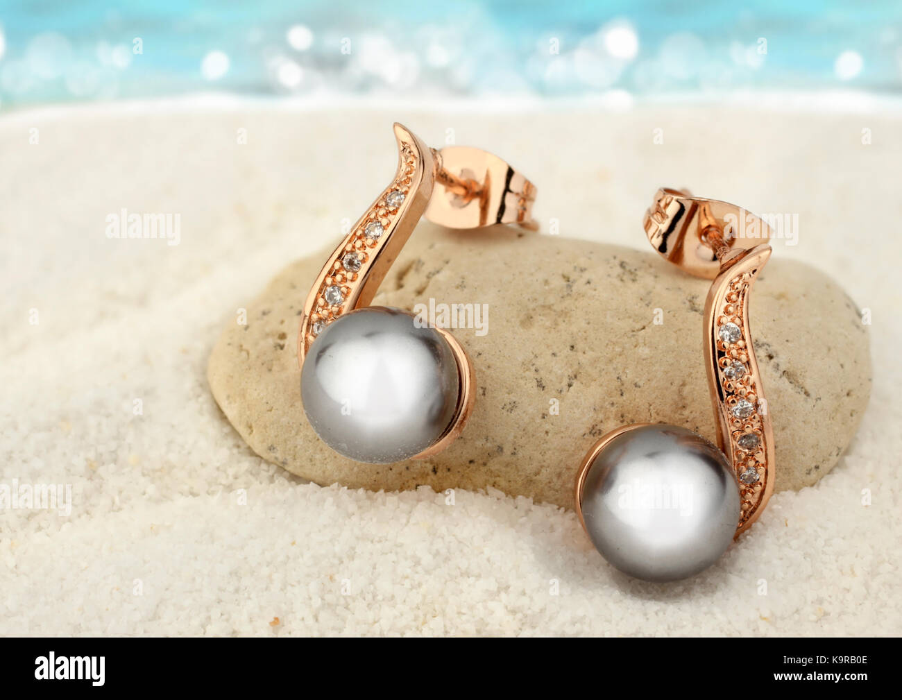 Stone and pearls on sand hi-res stock photography and images - Alamy