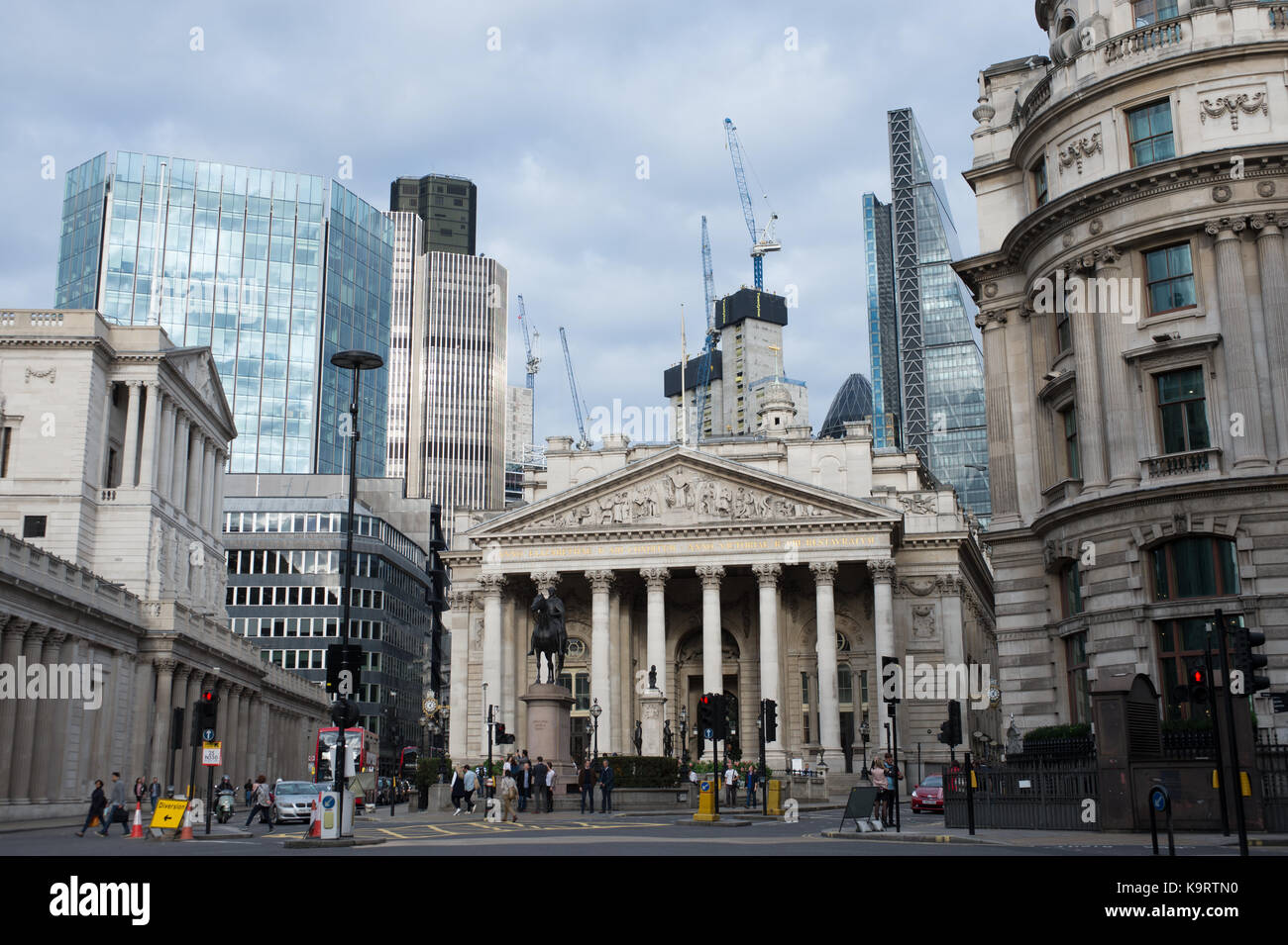 New buildings being built around old buildings in London. The Bank of ...