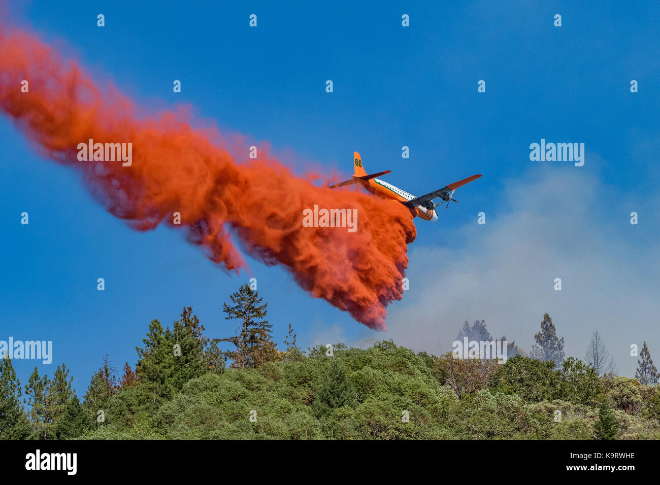 Air support planes dropping retardant on wild fire Stock Photo - Alamy