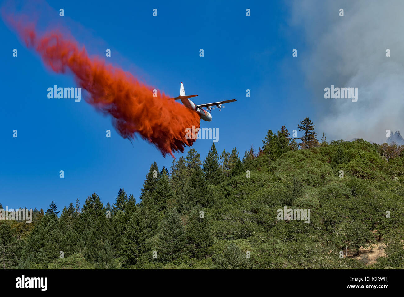 Air support planes dropping retardant on wild fire Stock Photo - Alamy