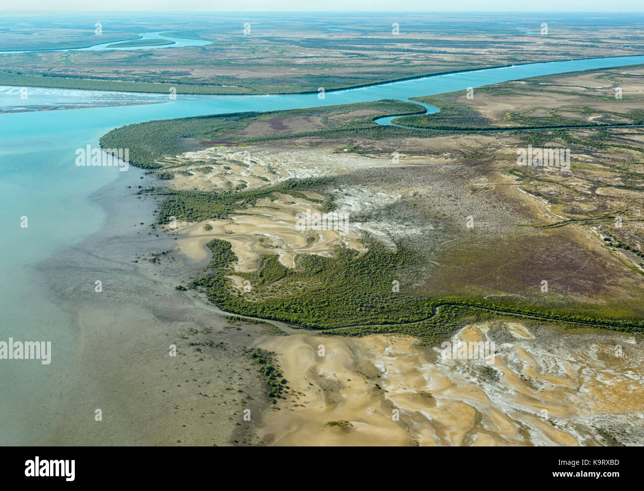 Aerial view of Albert River estuary and surrounding salt flats during ...