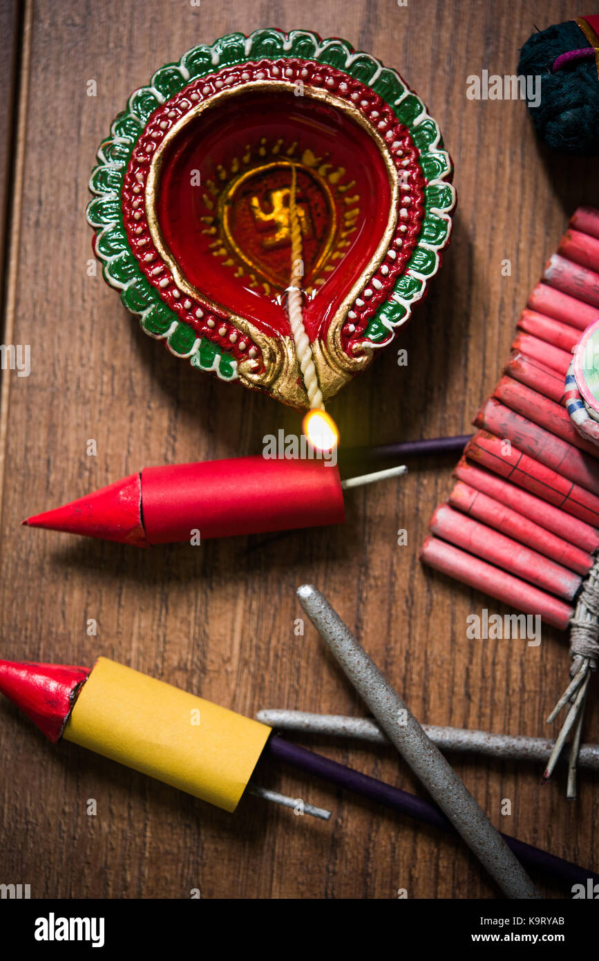 stock photo showing Diwali still life with Diya or oil Lamp and fire ...