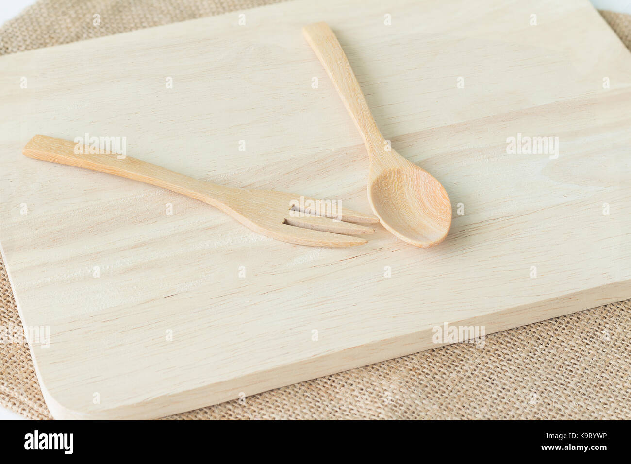 wood plate for serving food and wood spoon and fork Stock Photo - Alamy