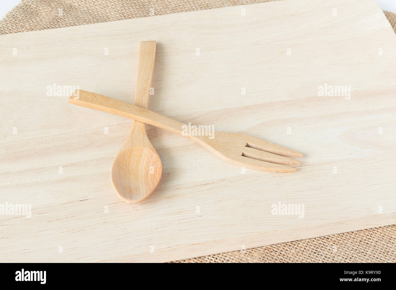 wood plate for serving food and wood spoon and fork Stock Photo - Alamy