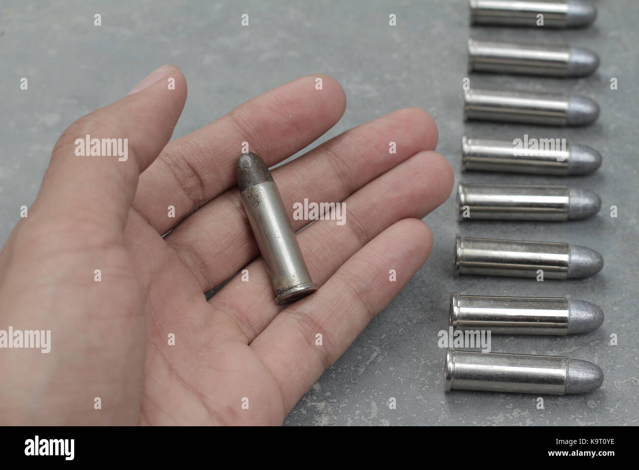 bullet and gun revolver Stock Photo - Alamy