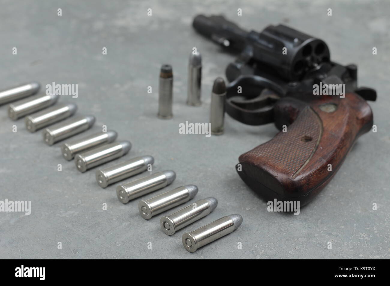 bullets and revolver Stock Photo - Alamy