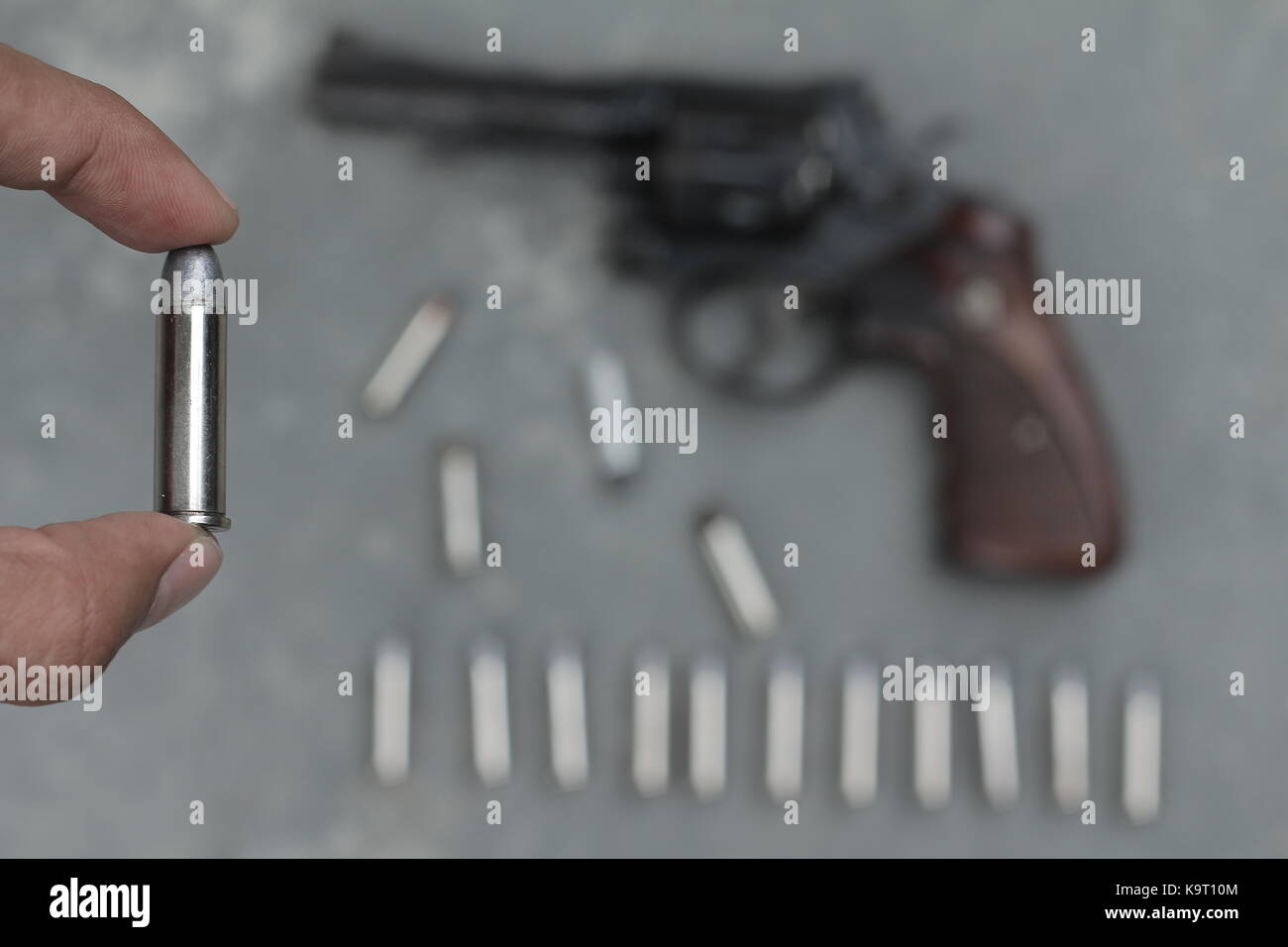 bullet and gun revolver Stock Photo - Alamy