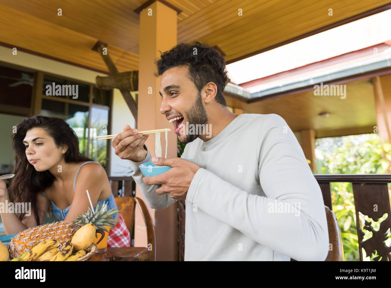 Cheerful People Tasting Asian Noodles Eating With Chopsticks Together ...