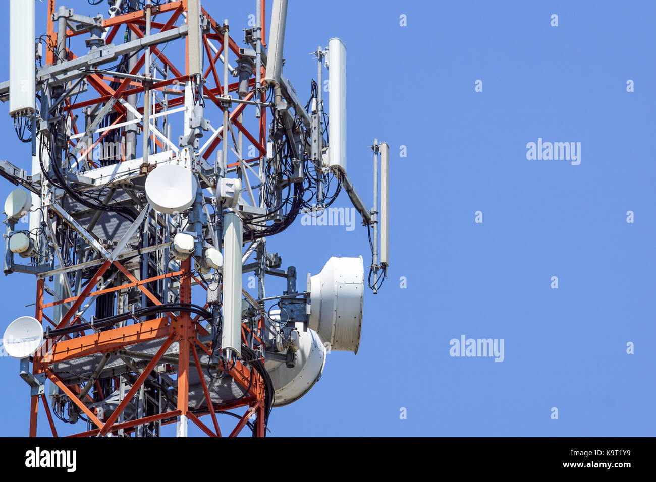 tower of communications with with a lot of different antennas under clear sky Stock Photo - Alamy