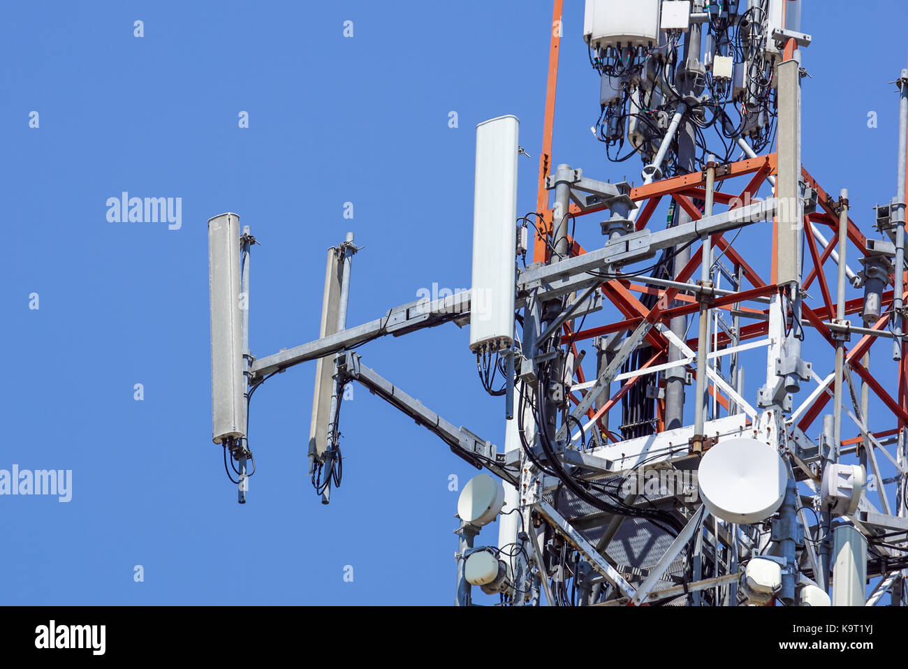 tower of communications with with a lot of different antennas under ...