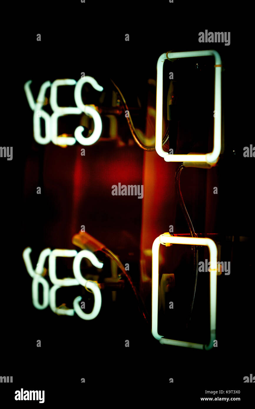 Neon sign showing tick-boxes for Yes and Yes Stock Photo - Alamy