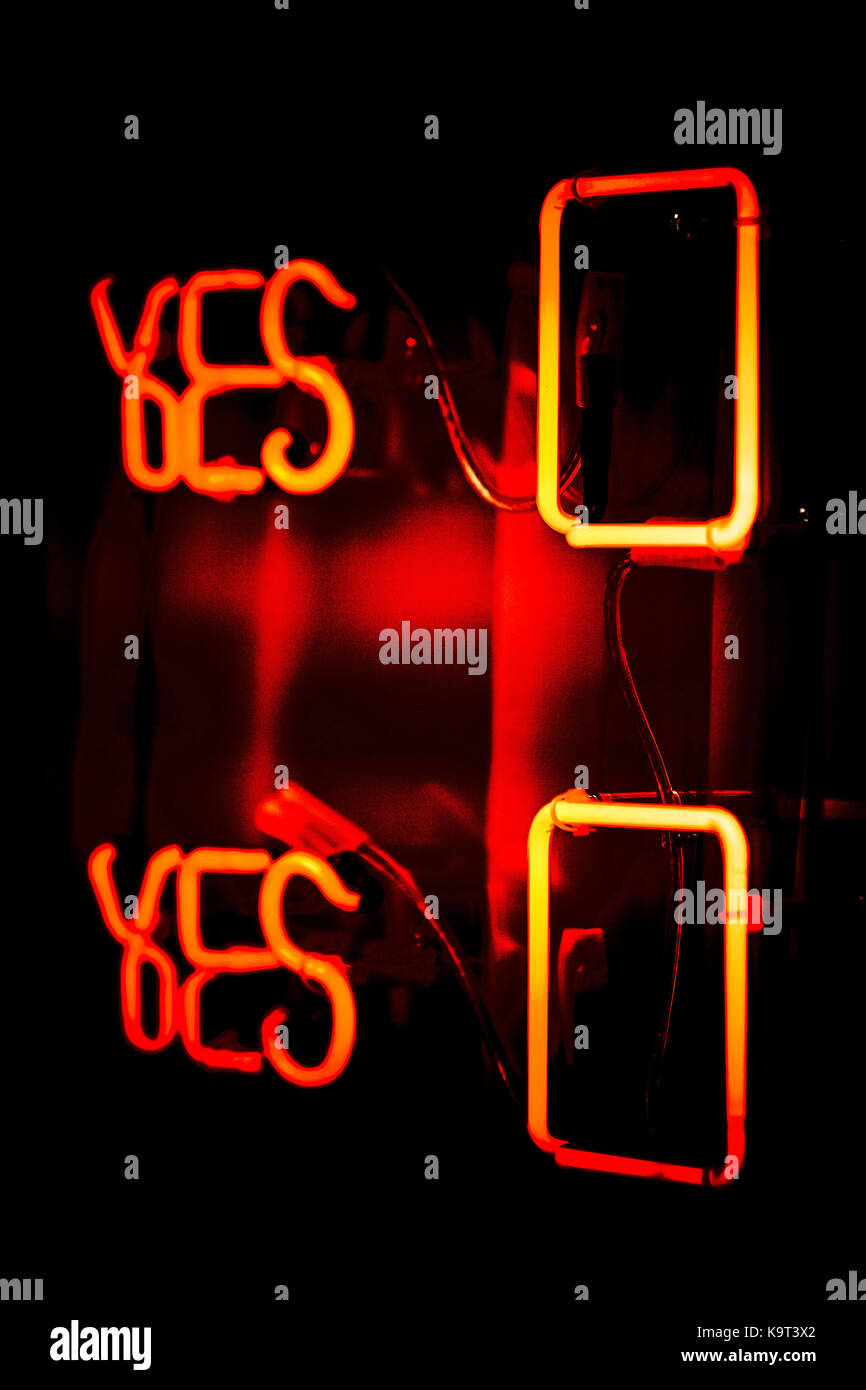 Neon sign showing tick-boxes for Yes and Yes Stock Photo - Alamy