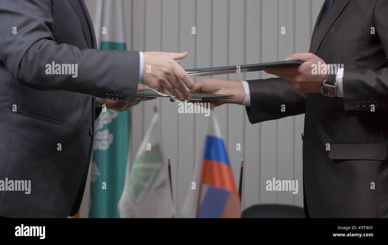 Two businessman with made a deal. Two businessmen shaking hands ...