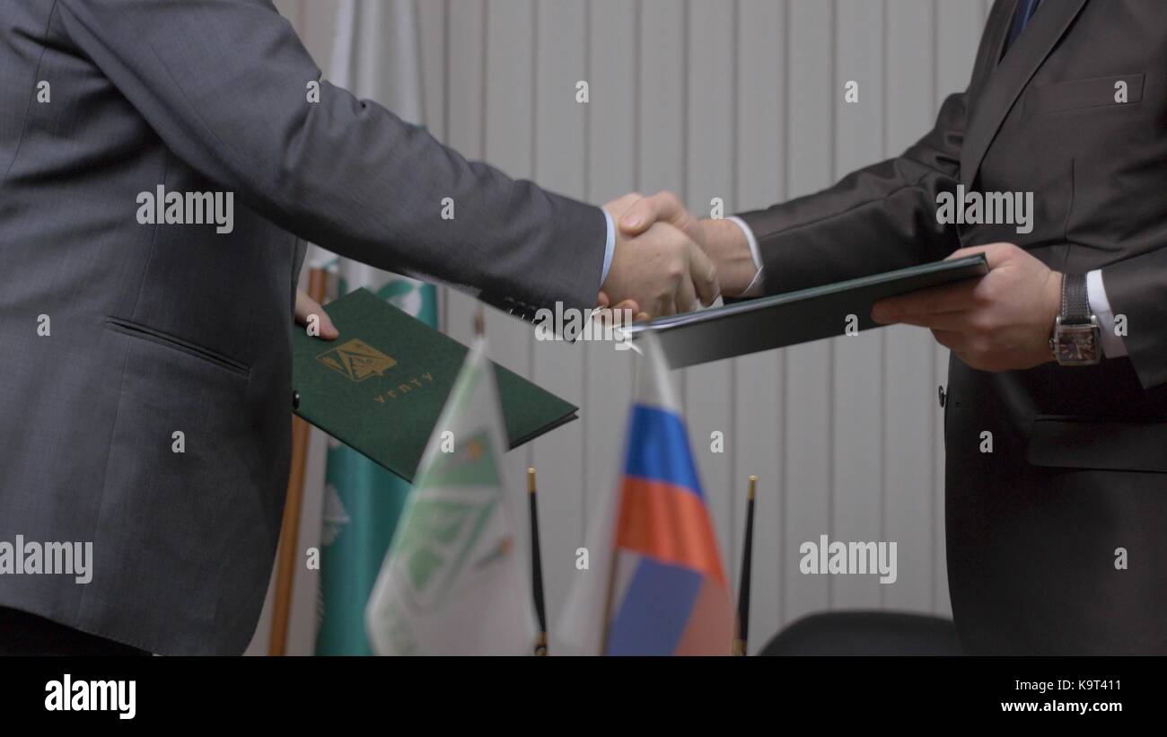 Two businessman with made a deal. Two businessmen shaking hands ...