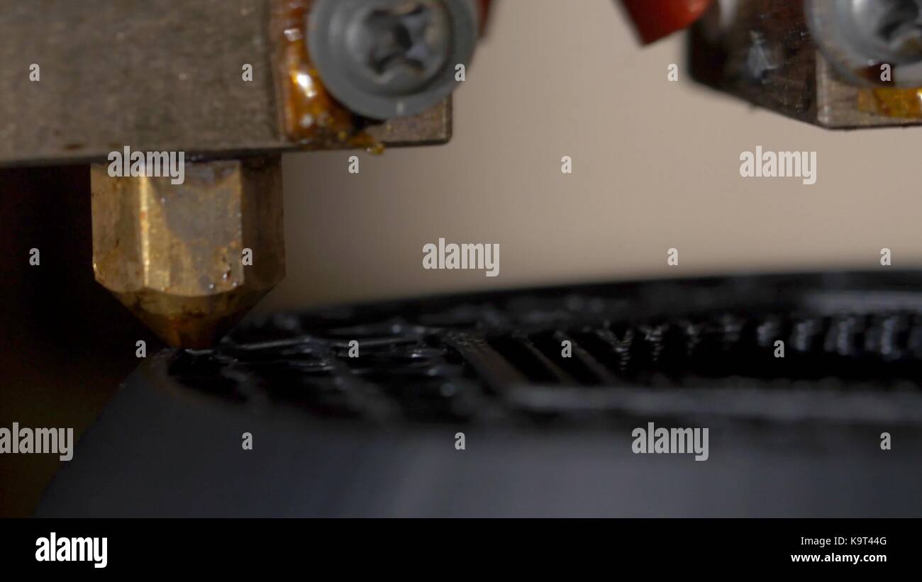 Close up of a modern 3D printer. Head of 3d printer in action. Close Up ...