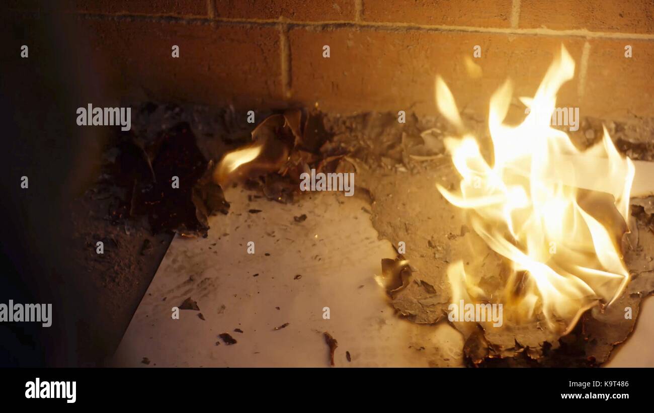Man puts out fire using foot. Man Extinguishing a campfire Stock Photo ...