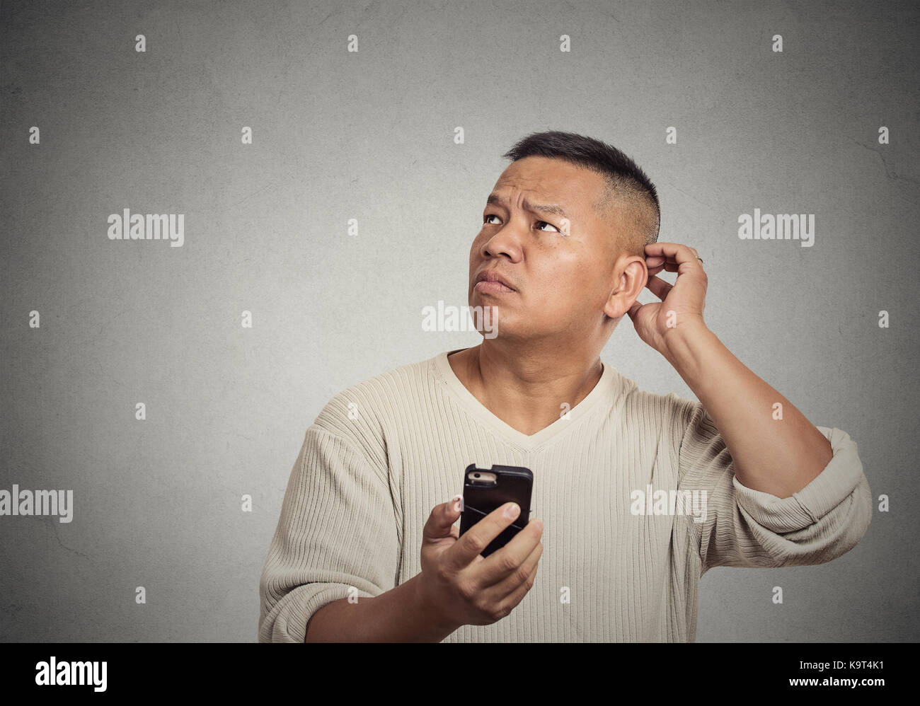 Closeup portrait puzzled confused business man looking up thinking what ...
