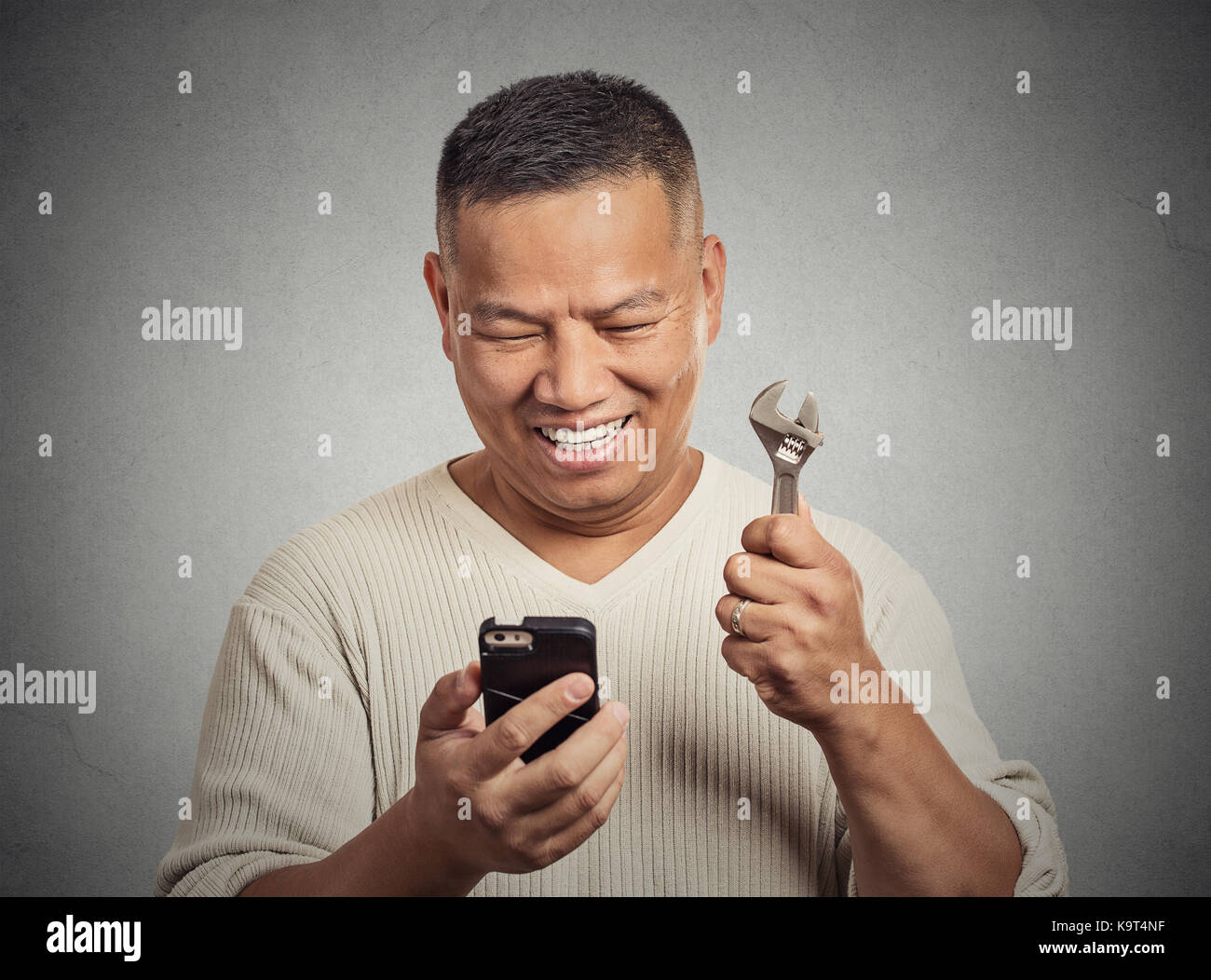 Business solution tools concept. Man looking at smartphone holding ...