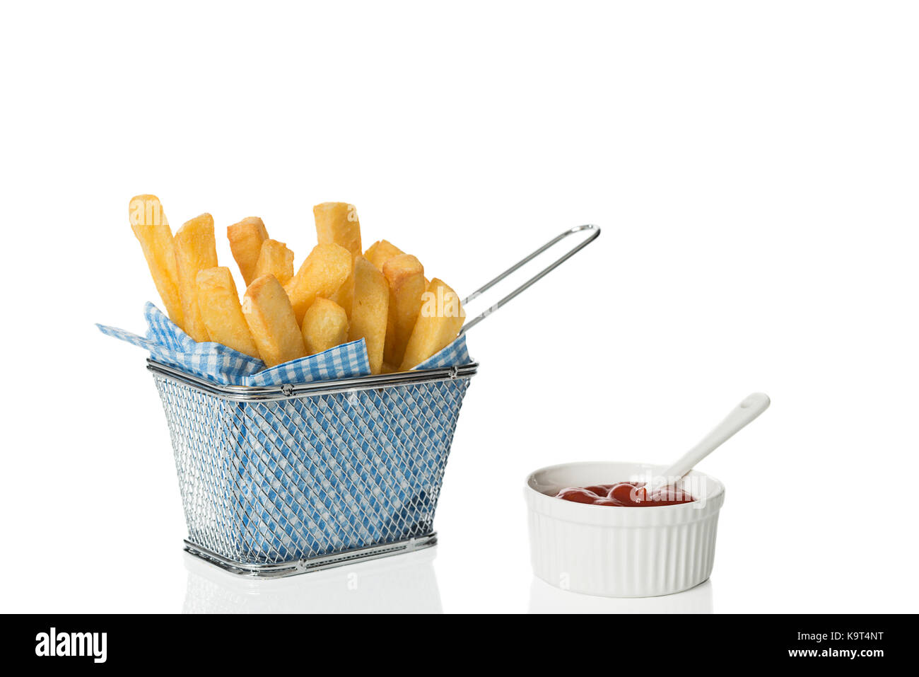 Portion of freshly cooked chips with tomato sauce on a white background ...