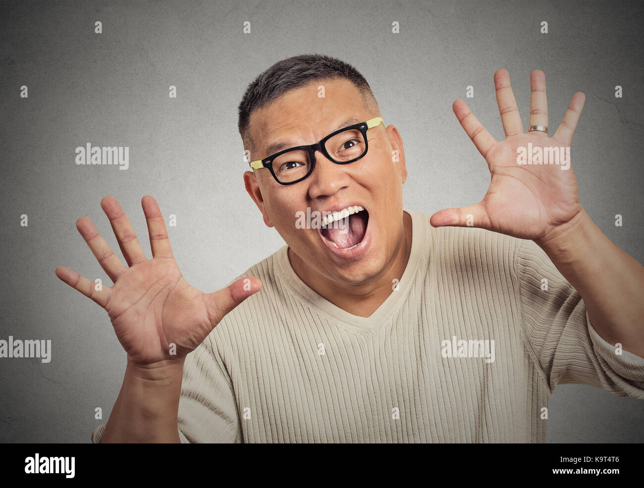 closeup super excited funky guy with glasses looking at you arms hands ...