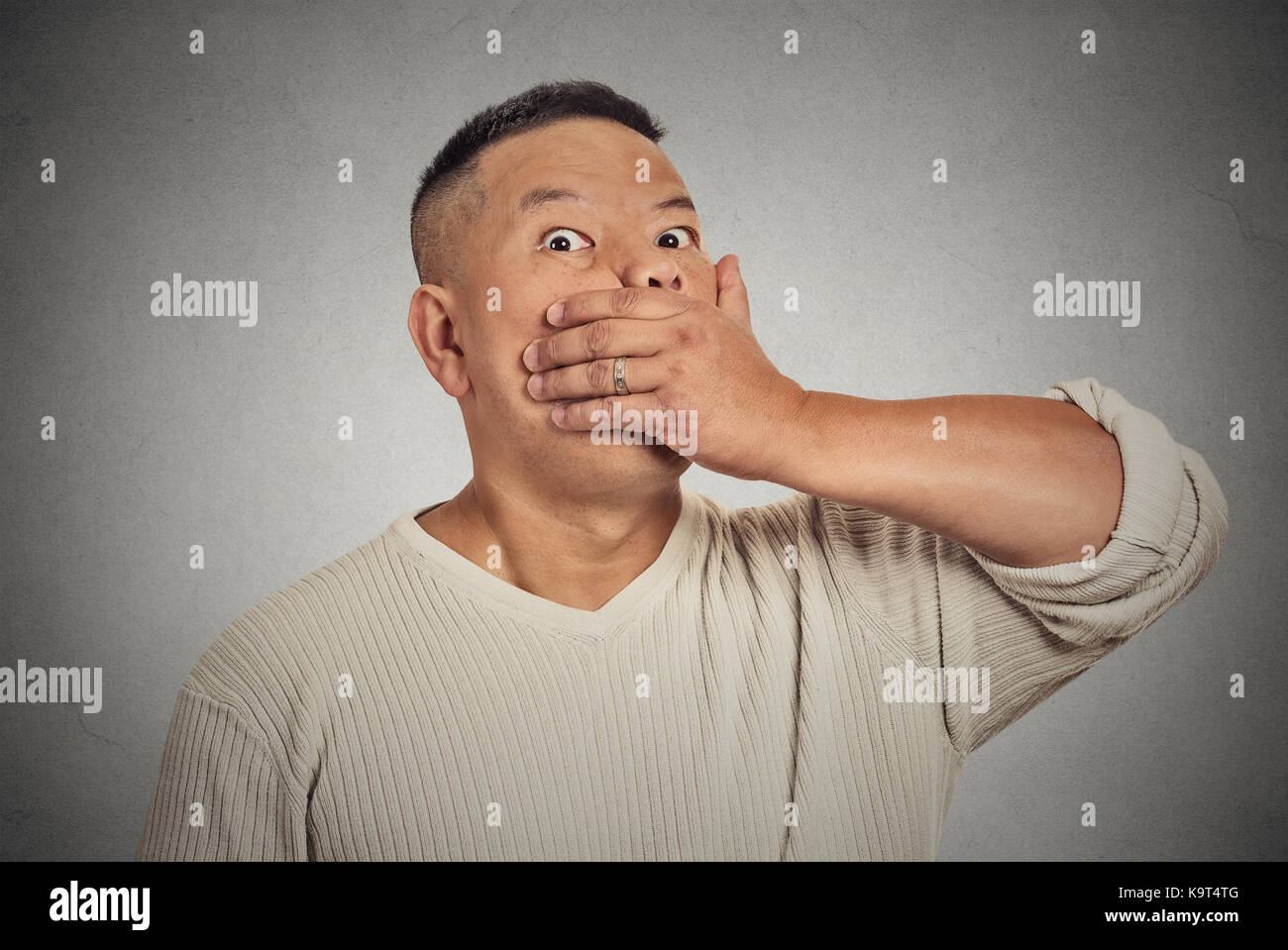 Headshot Afraid Victim Man With Hand Covering His Mouth Isolated On