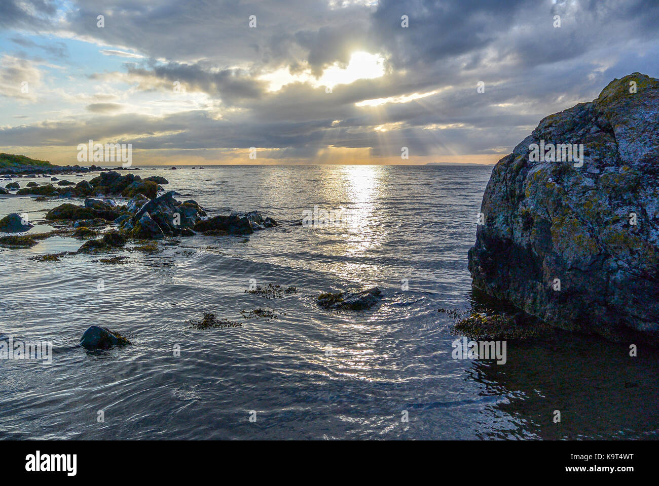 Sunset with red skies over the sea and beach from Lendalfoot near ...