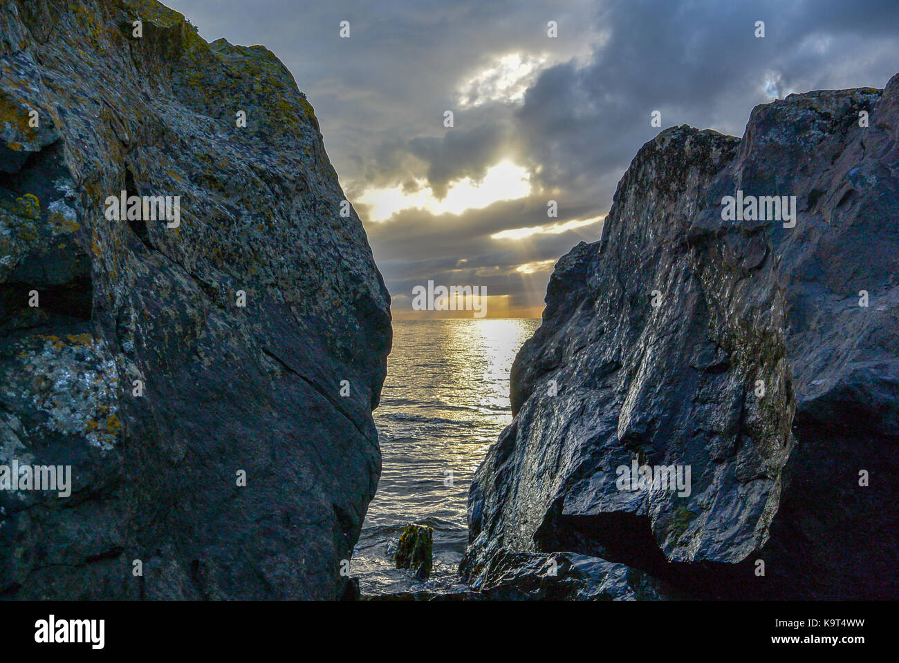 Sunset with red skies over the sea and beach from Lendalfoot near ...