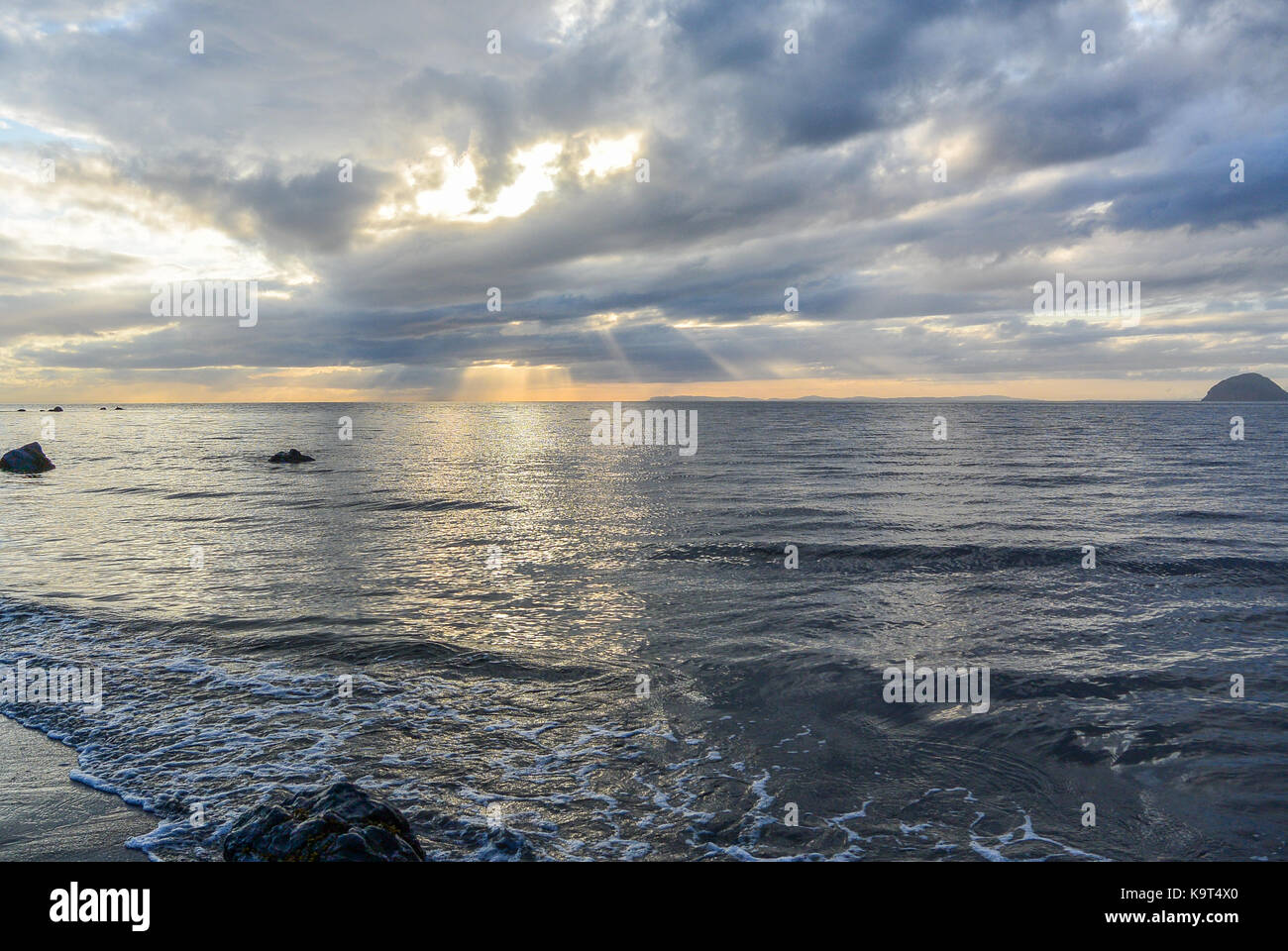 Sunset with red skies over the sea and beach from Lendalfoot near ...