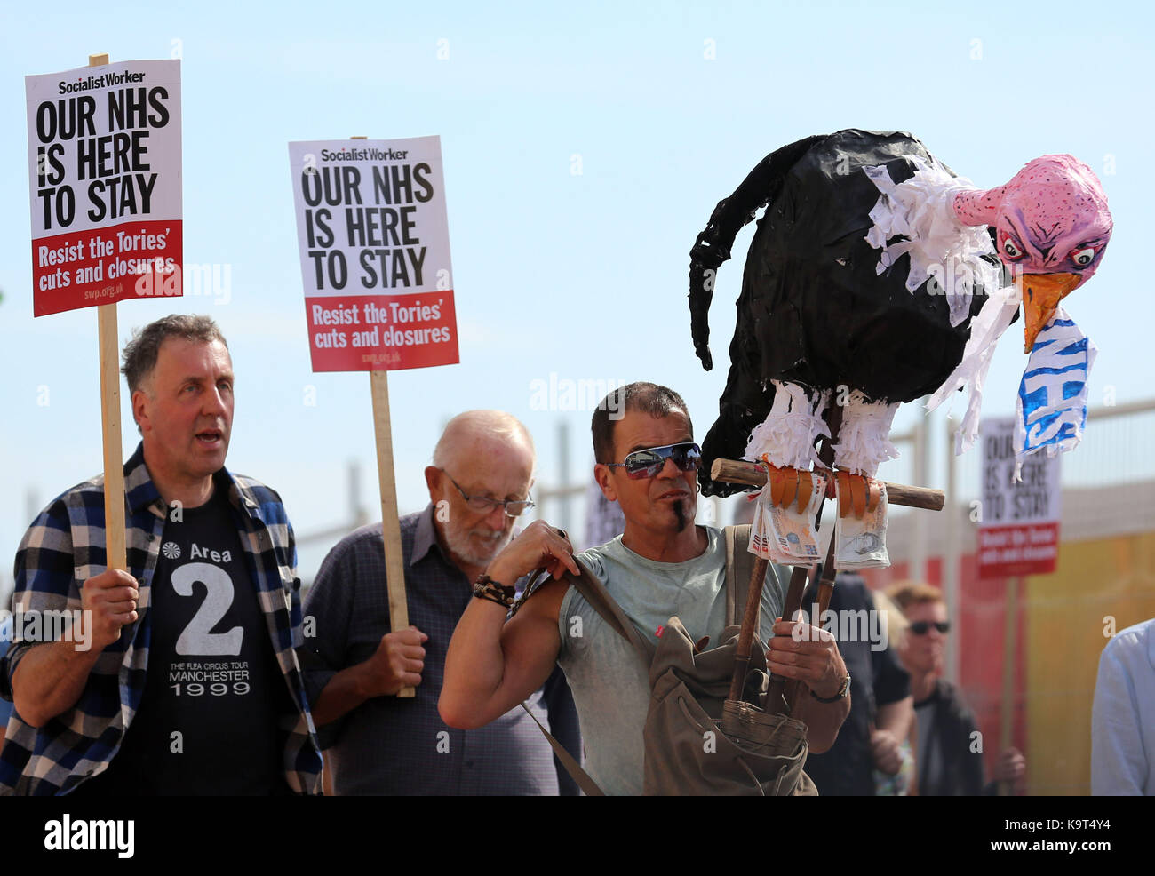 Labour supporters campaign against NHS cuts during the Labour Party ...