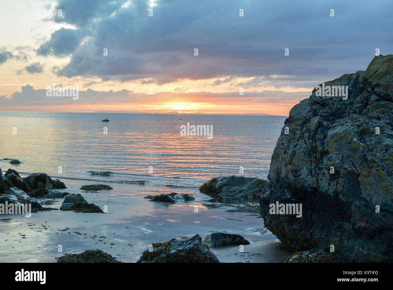 Sunset with red skies over the sea and beach from Lendalfoot near ...