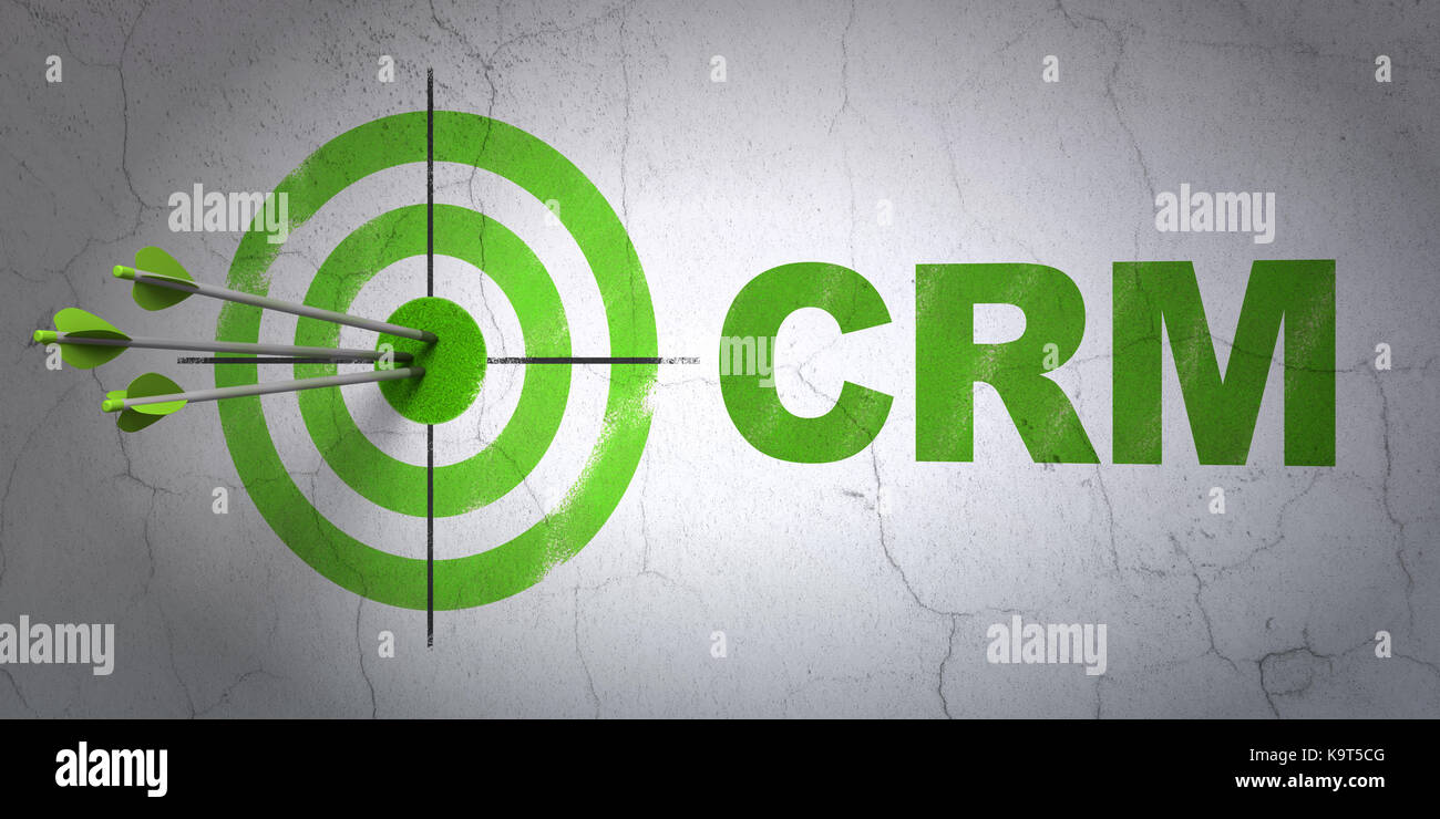 Business concept: target and CRM on wall background Stock Photo - Alamy