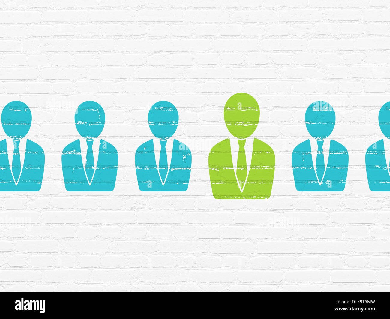 Business concept: business man icon on wall background Stock Photo - Alamy