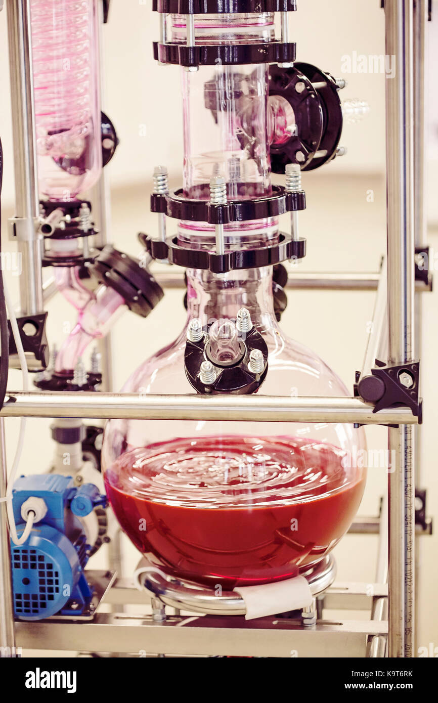 Laboratory chemical machine with moving red liquid Stock Photo - Alamy