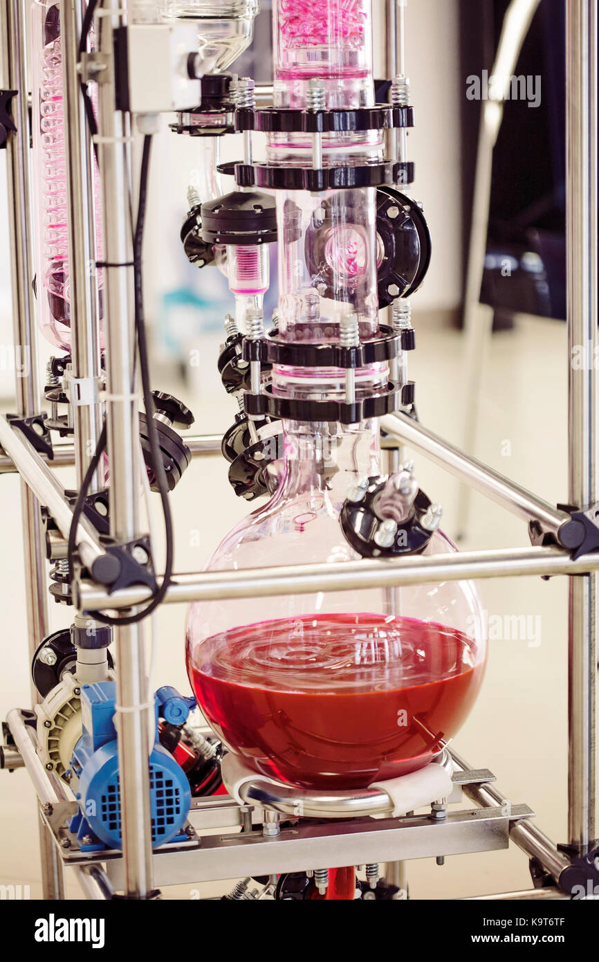 Laboratory chemical machine with moving red liquid Stock Photo - Alamy