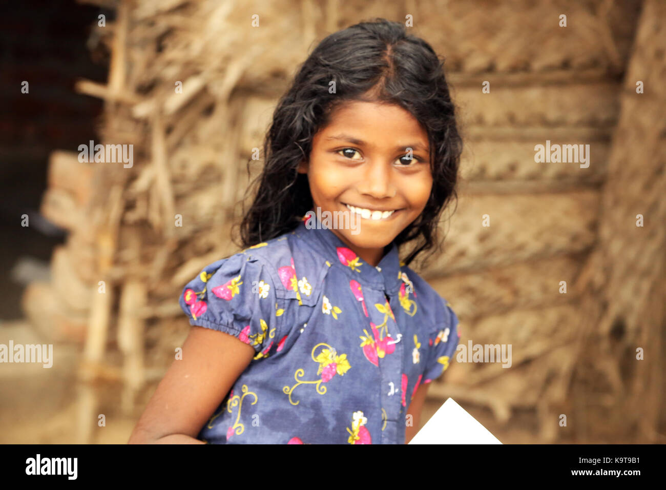 Unidentified Happy Indian rural girl smiling at camera Stock Photo - Alamy