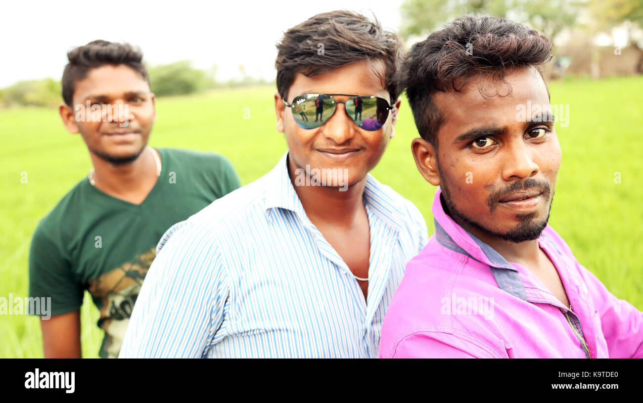 Three Boys Smiling At The Camera Stock Photo - Alamy