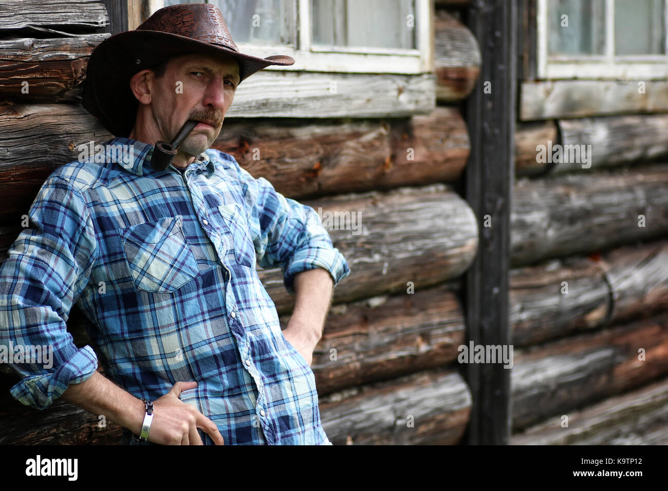 cowboy man smoke pipe Stock Photo - Alamy