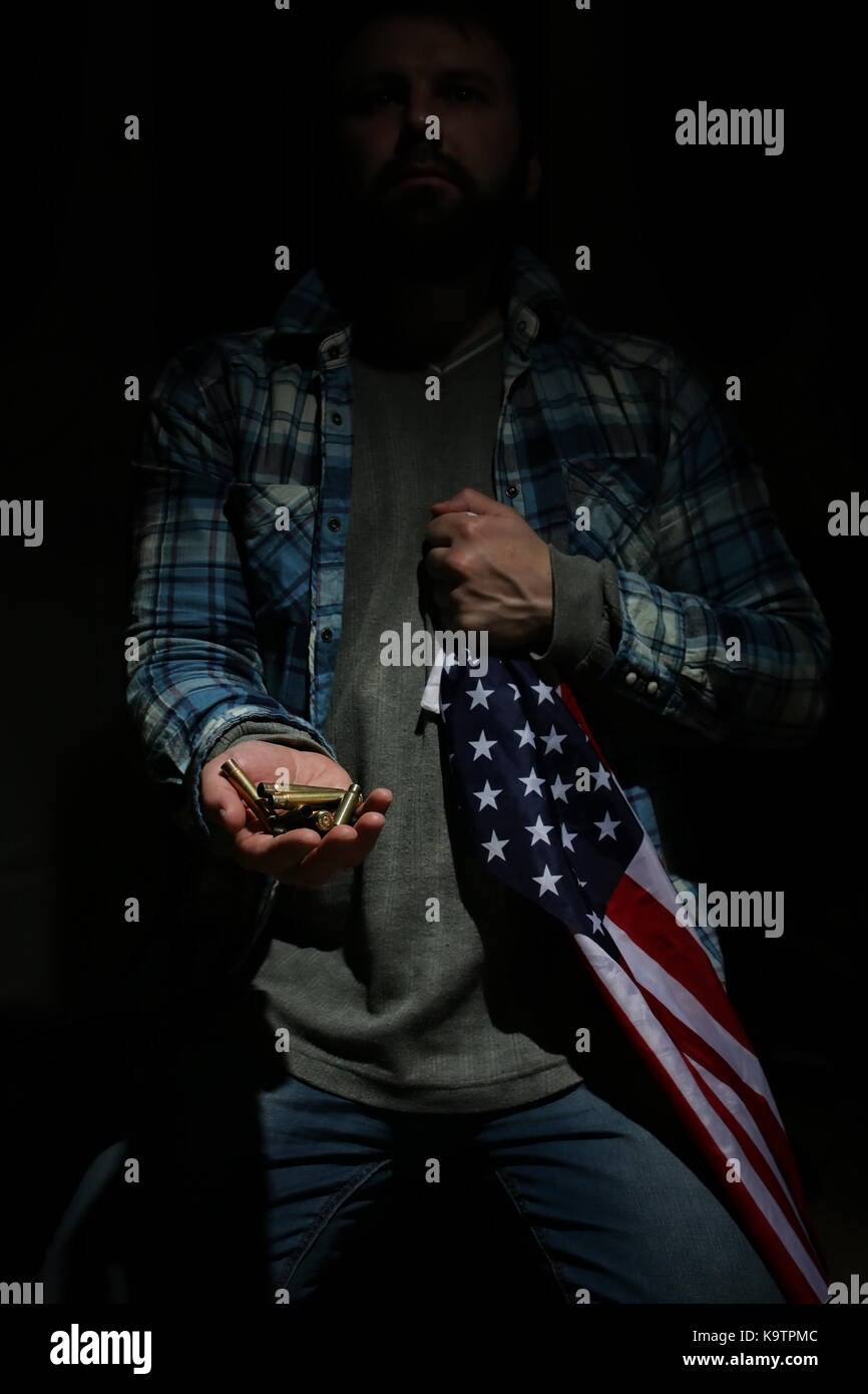 bullet in hands man Stock Photo - Alamy