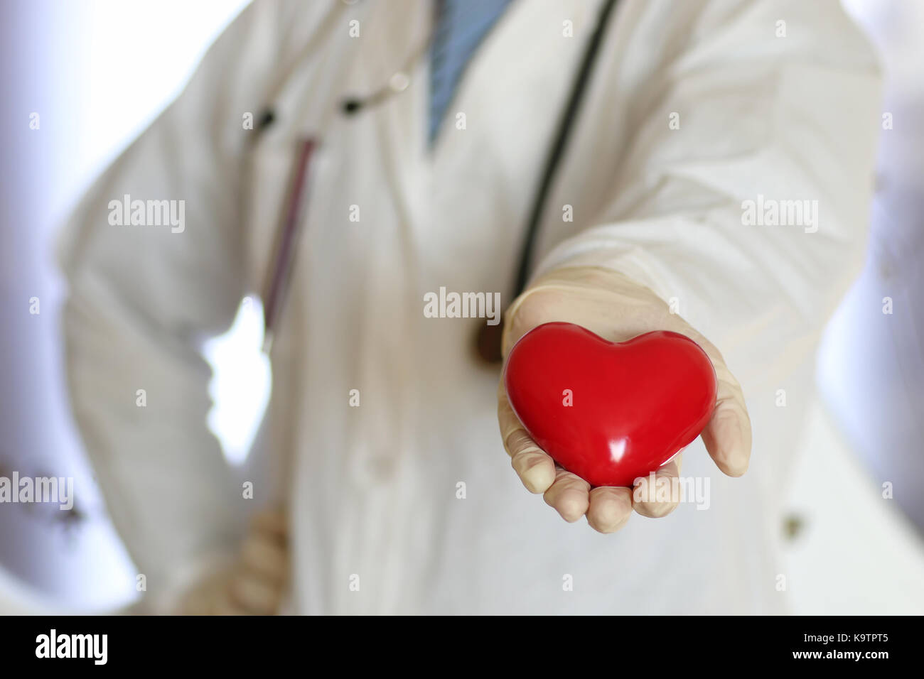 heart in doctor hand Stock Photo - Alamy