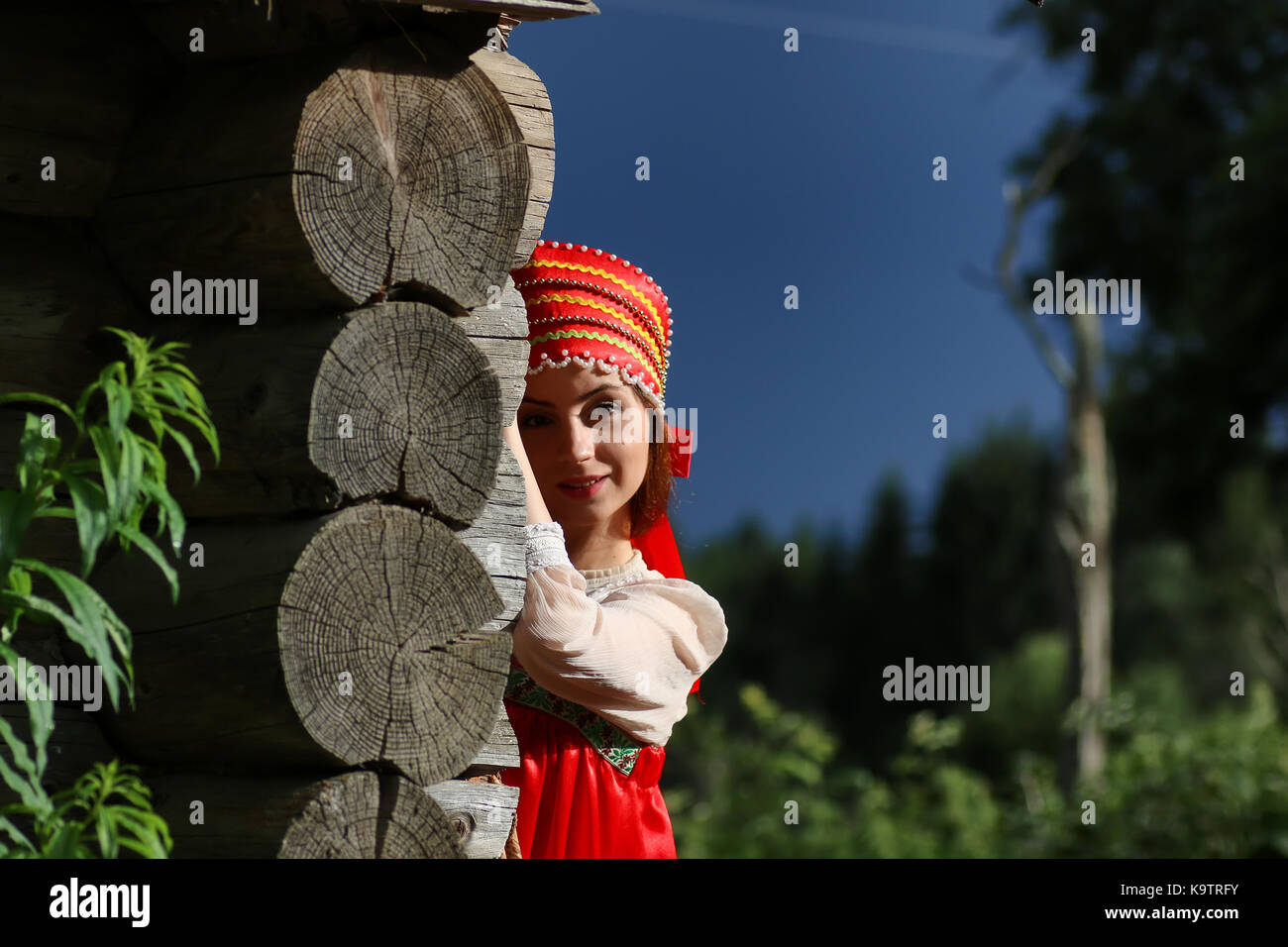 girl traditional dress log Stock Photo - Alamy