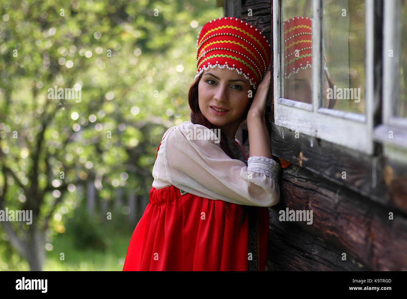 Slav woman in traditional dress wooden wall Stock Photo - Alamy