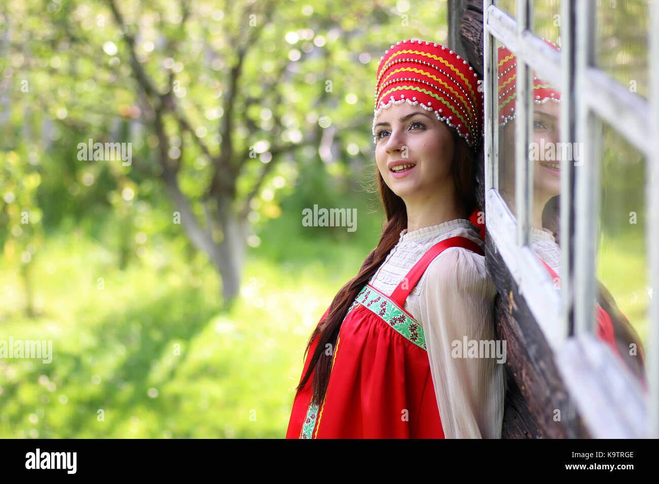 Slav woman in traditional dress wooden wall Stock Photo - Alamy