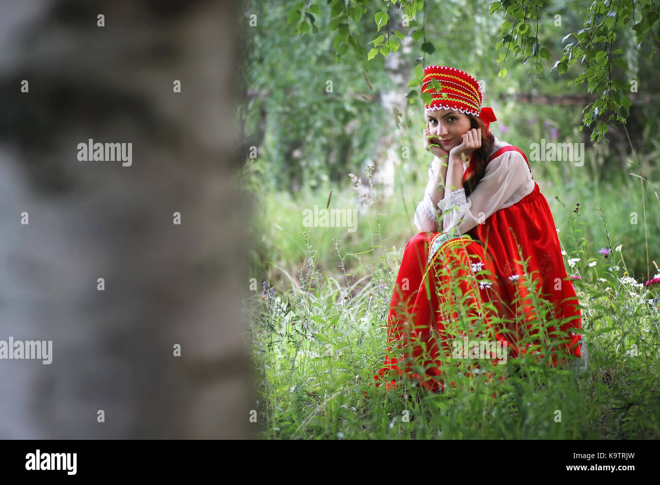 Slav in traditional dress is sitting in nature Stock Photo - Alamy