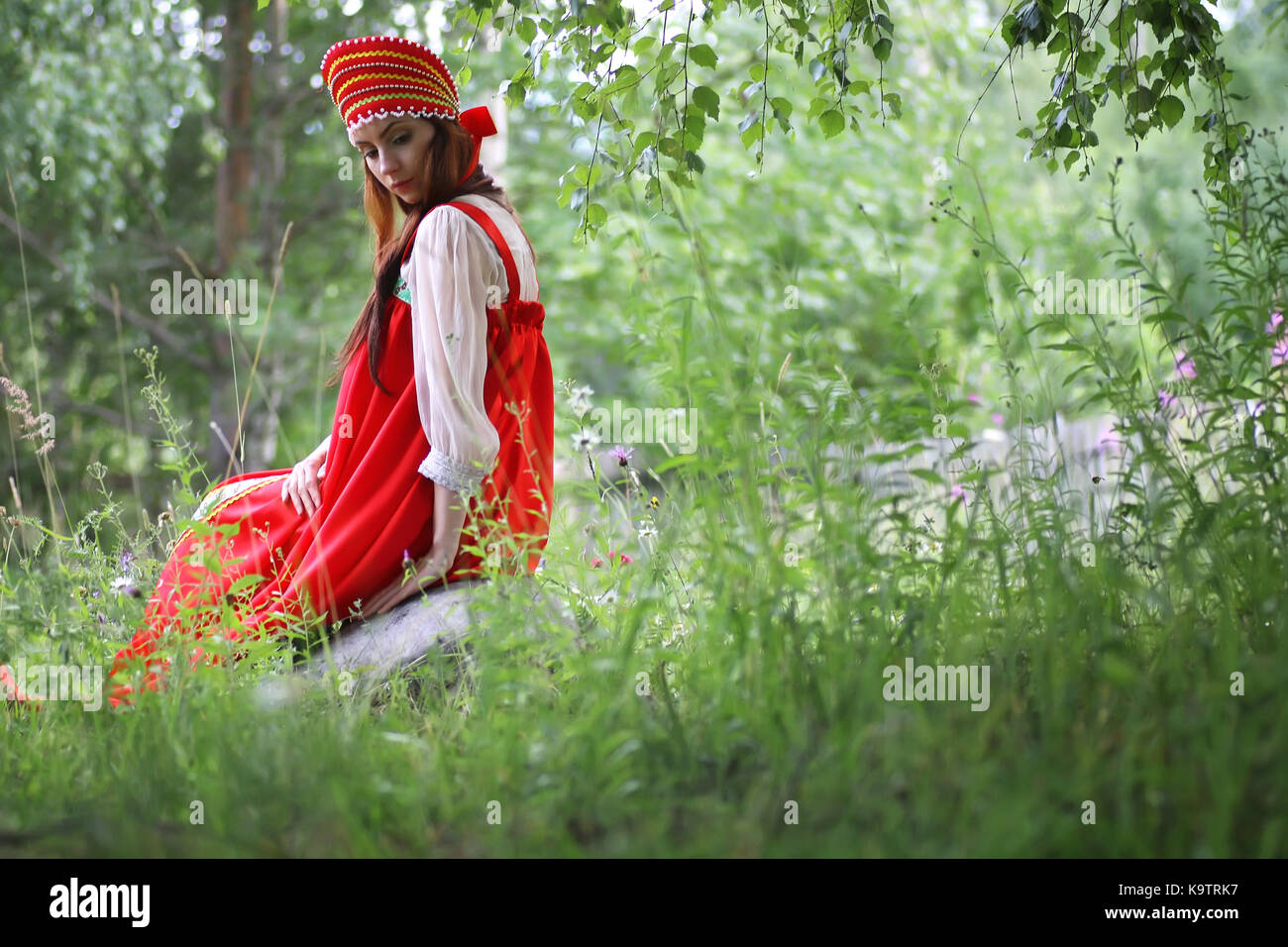 Slav in traditional dress is sitting in nature Stock Photo - Alamy