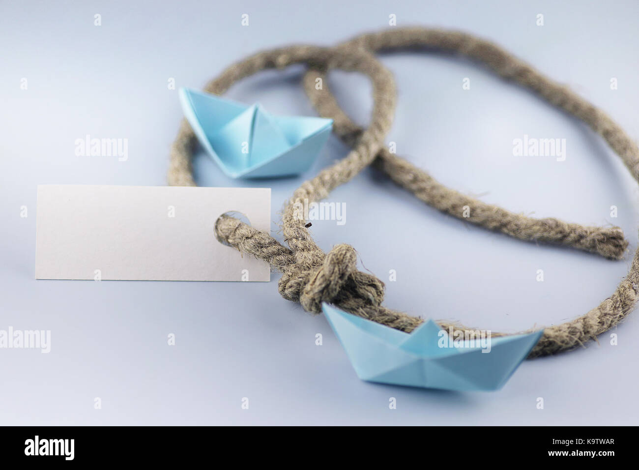 sticker with thick braided rope and ship paper origami Stock Photo - Alamy