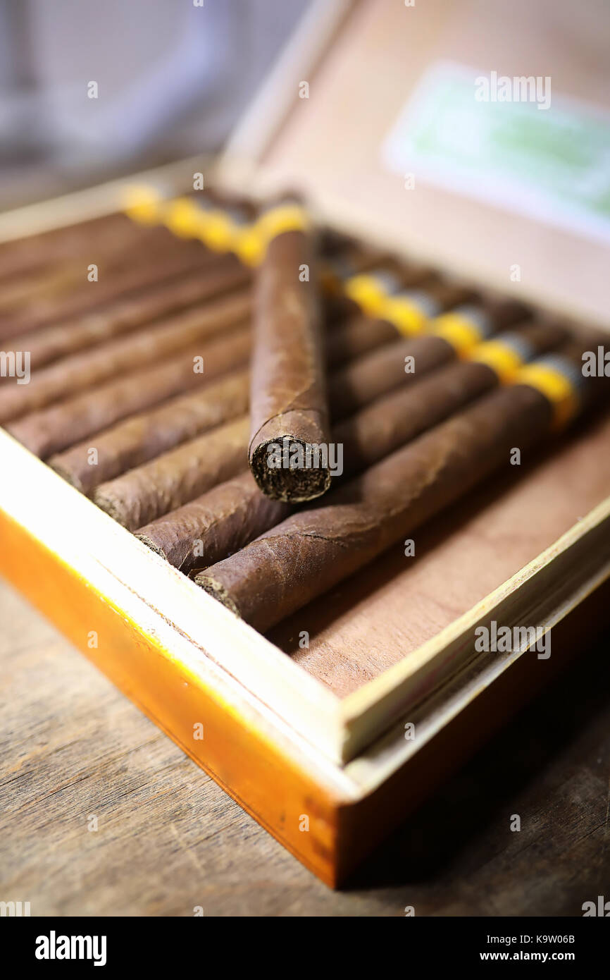 Large box of Cuban cigars on a wooden table Stock Photo - Alamy
